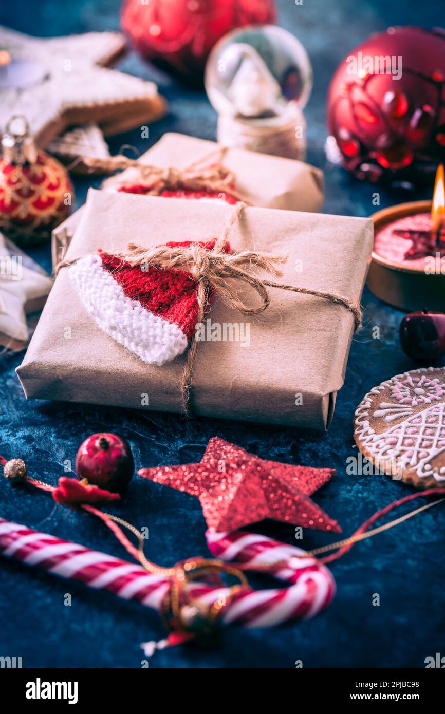 Handmade wrapped christmas gift boxes with decorations and gingerbread ...