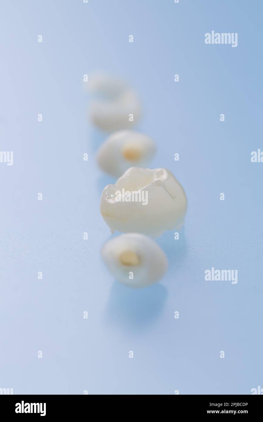Primary teeth on blue background. Baby teeth, concept of dental care ...