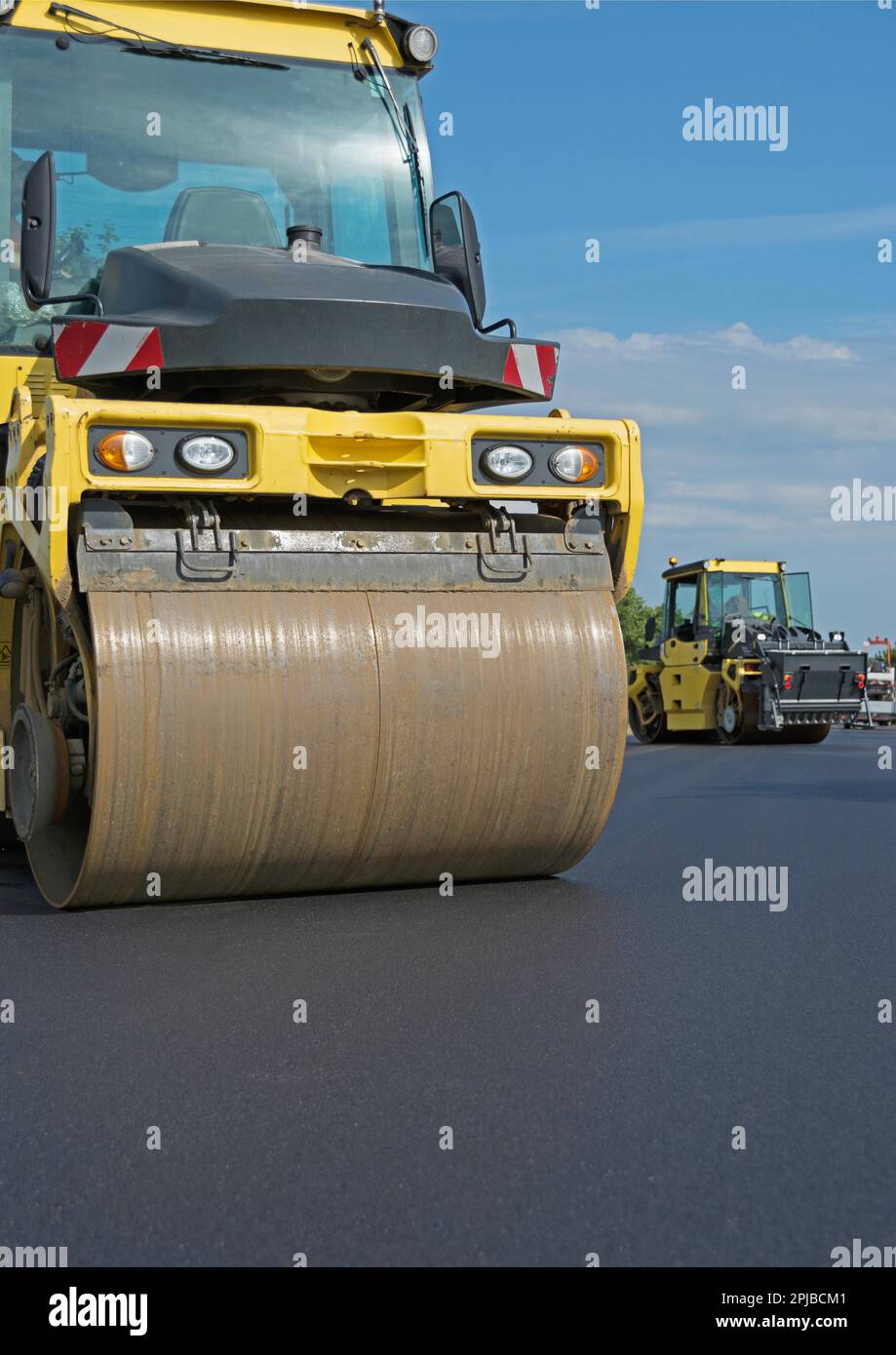 Road construction rollers in use, portrait format Stock Photo - Alamy