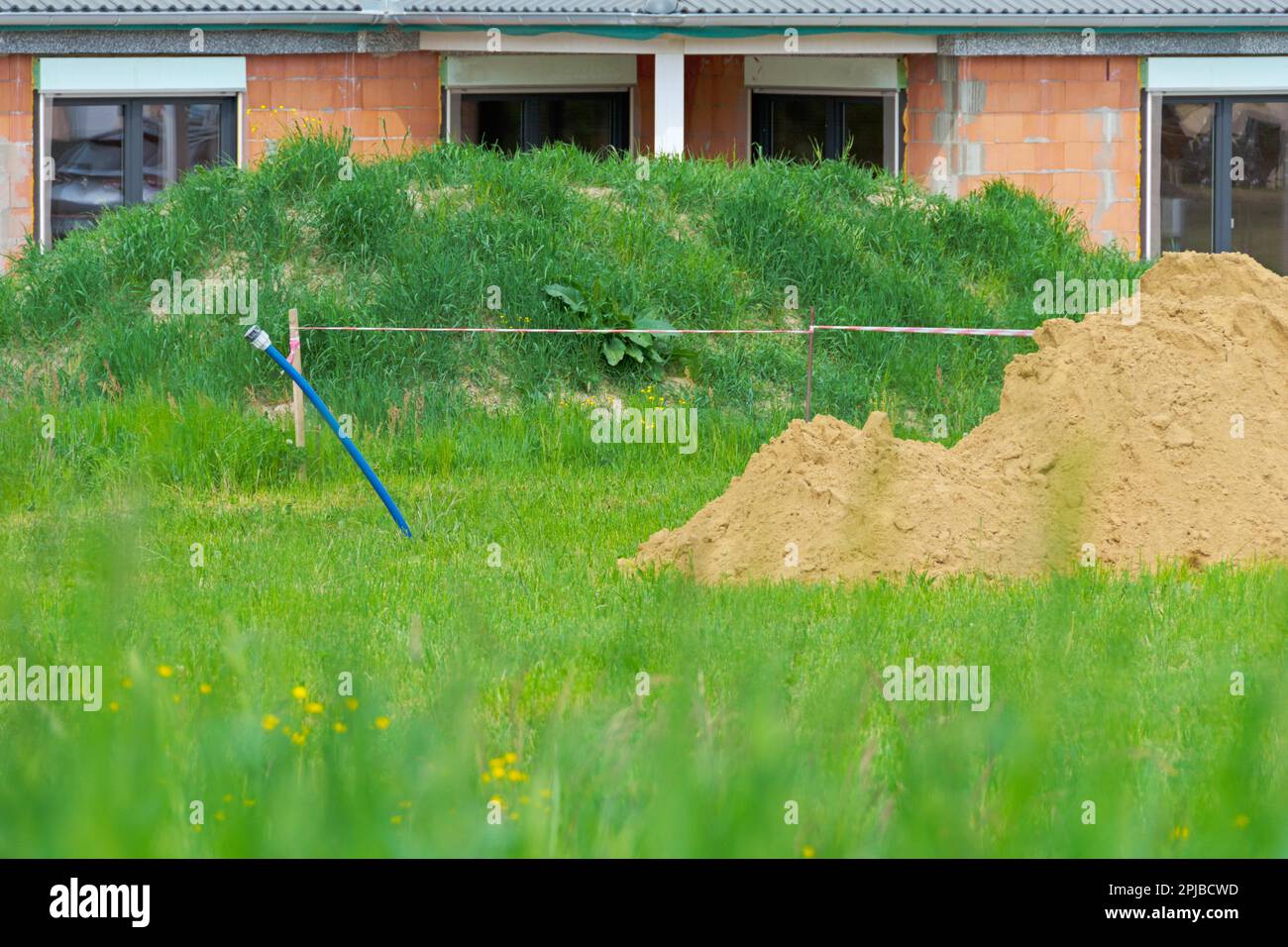View of building plot with shell in the background Stock Photo - Alamy