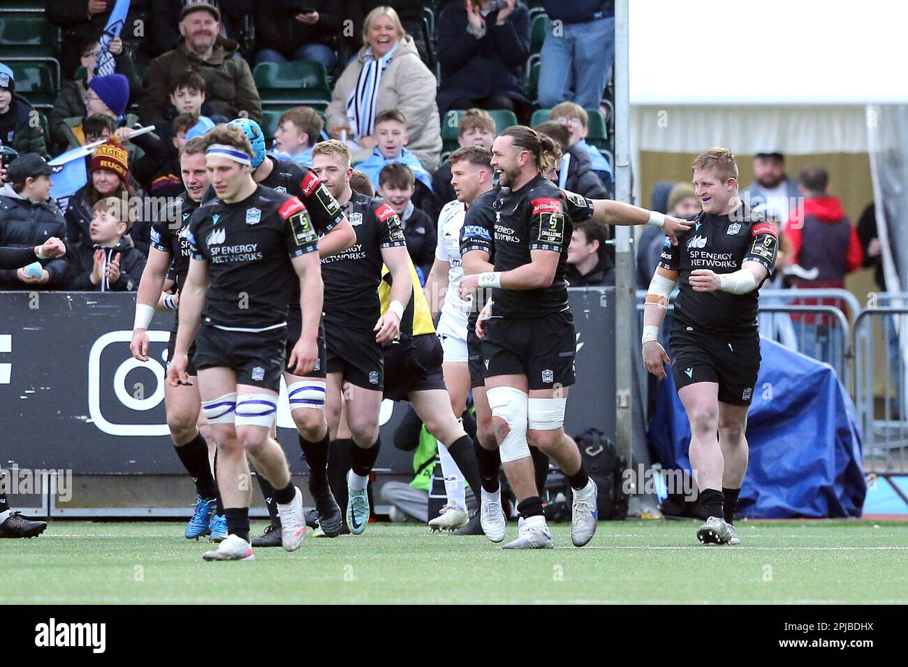 Glasgow Warriors' Johnny Matthews (right) celebrates scoring a try with ...
