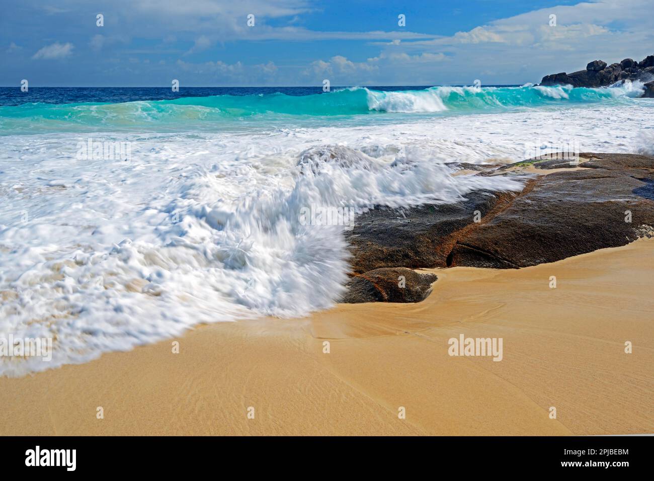 Spray and surf on the dream beach Anse Intendance, Mahe Island ...