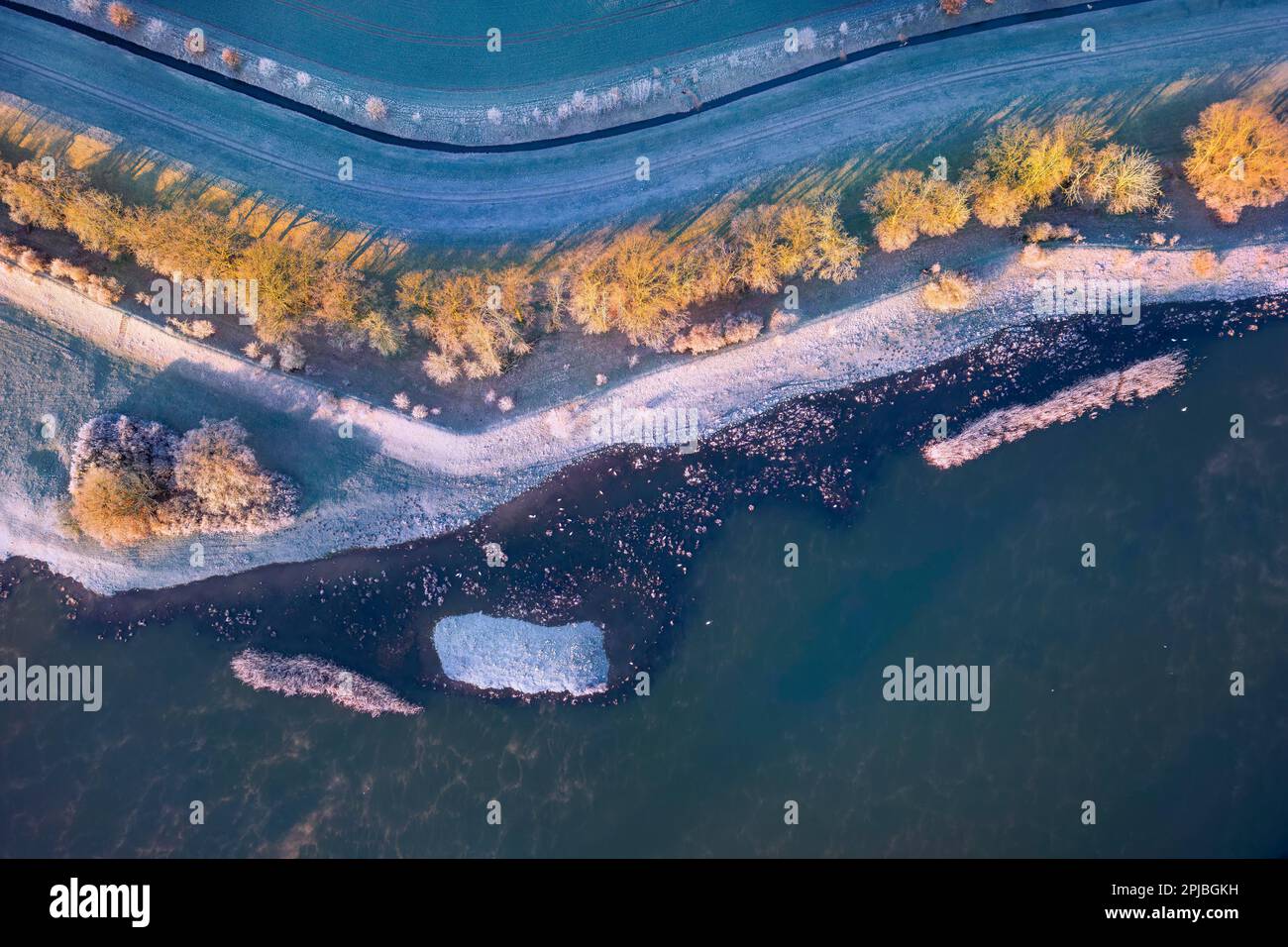 Aerial view, lake landscape, snow, frost, reed area, river course ...