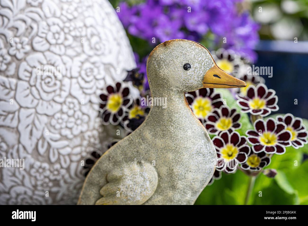 little tin goose with big ornamented egg, primrose and lilac spring ...
