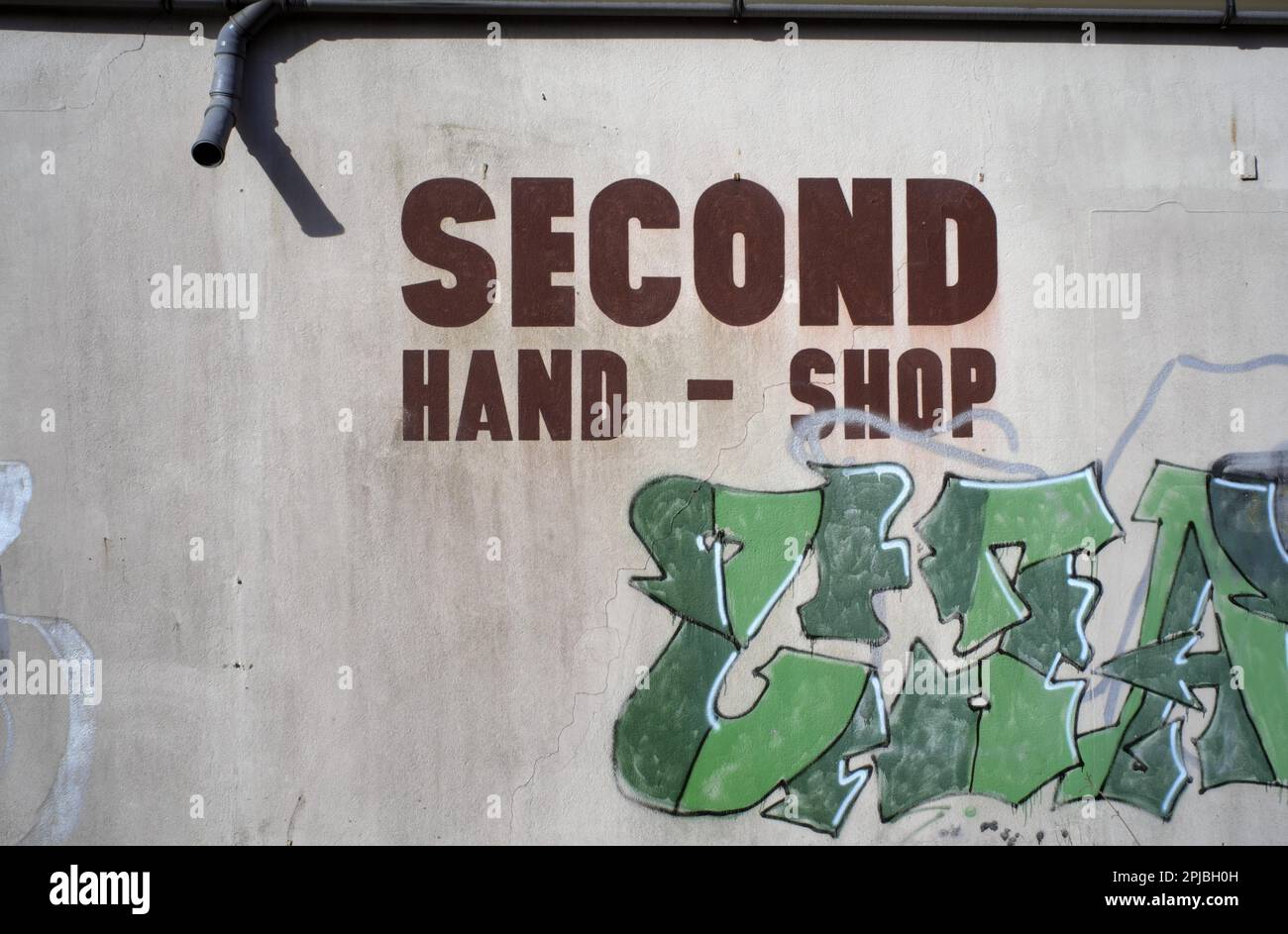 Graffiti on a second hand shop Stock Photo - Alamy