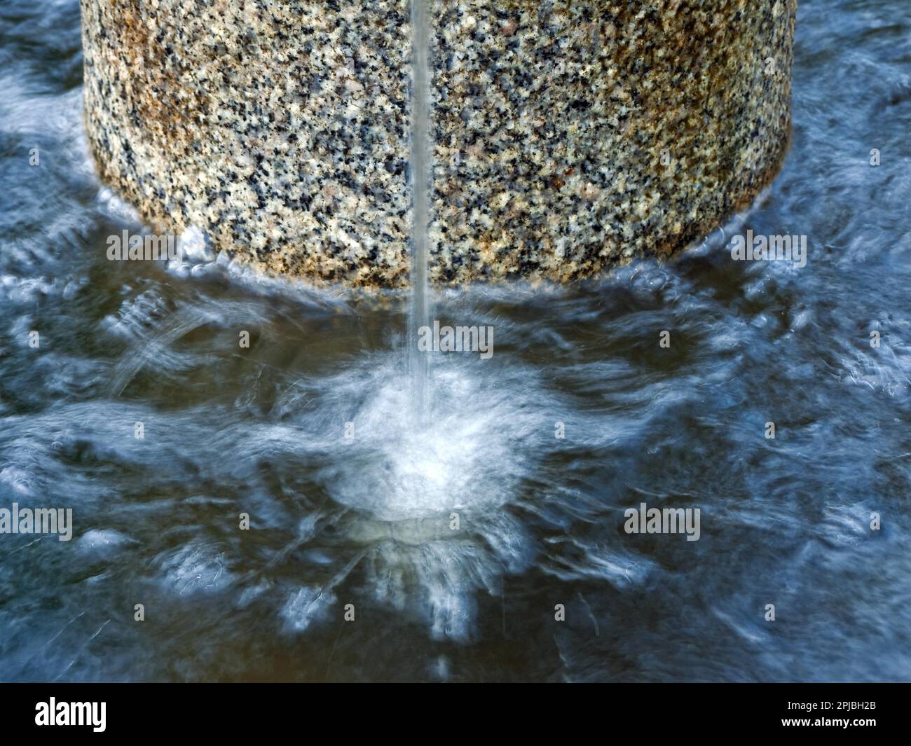Water flows into wells Stock Photo - Alamy