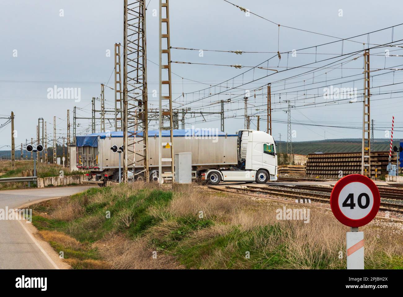 Truck crossing the train roads through a level Stock Photo - Alamy