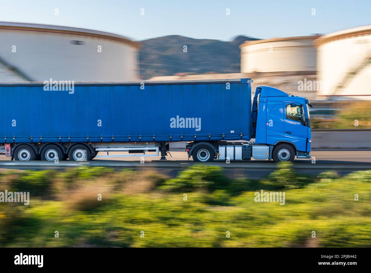 Truck with sliding canvas for general transport circulating along a ...