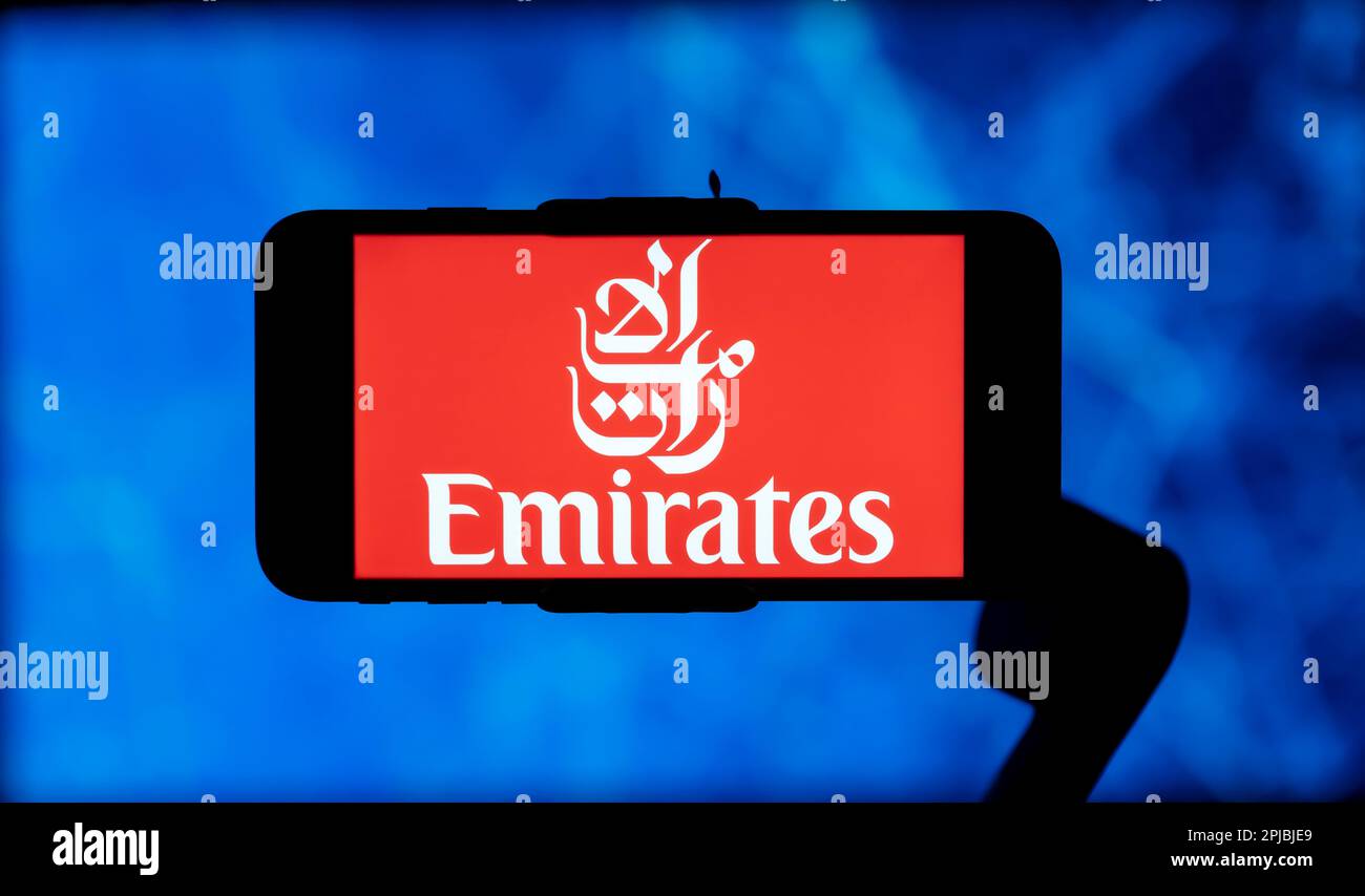 In this photo illustration, the Emirates logo is seen displayed on a ...