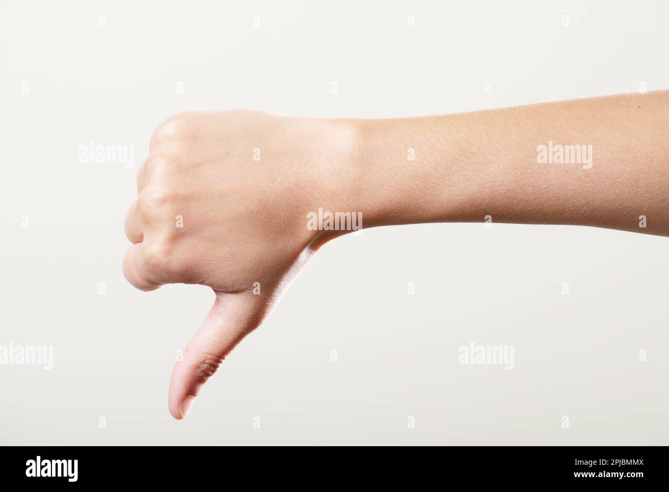 Thumbs down hand isolated on white background, disagree hand gesture ...