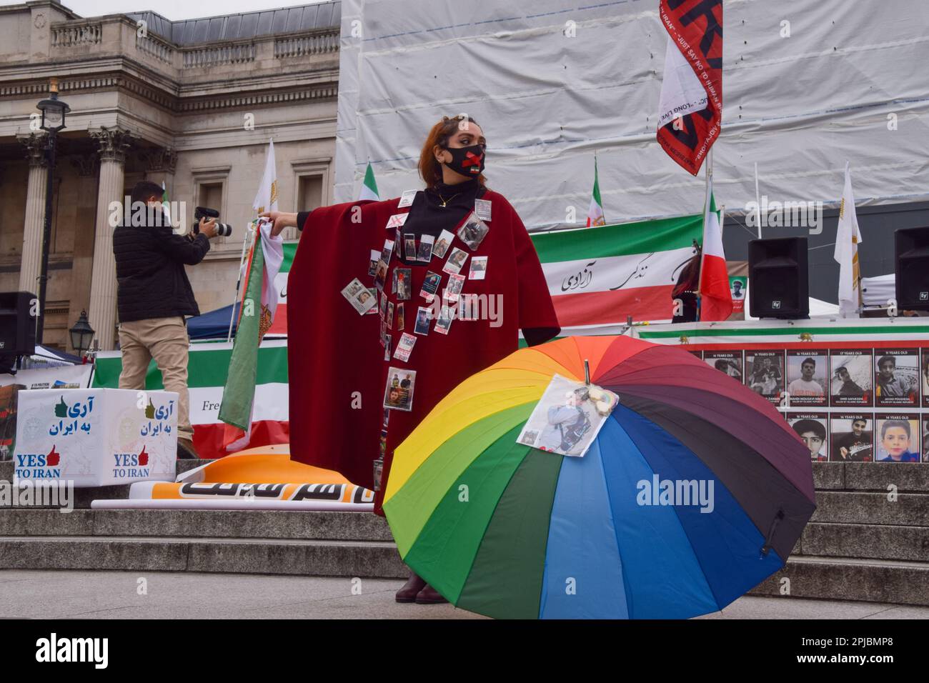 London, England, UK. 1st Apr, 2023. A protester displays pictures of ...