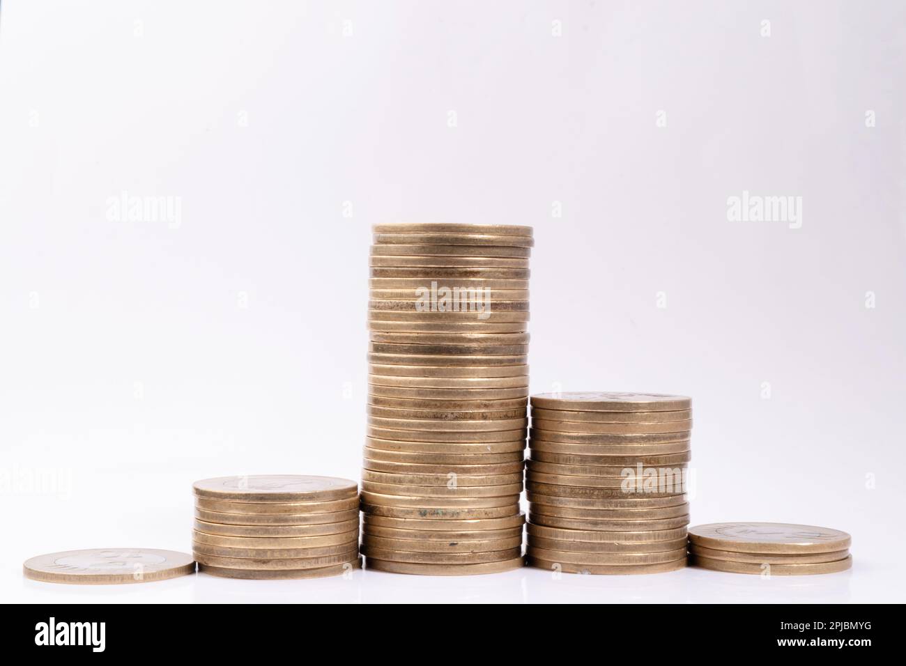 Coin stack on white background Stock Photo - Alamy