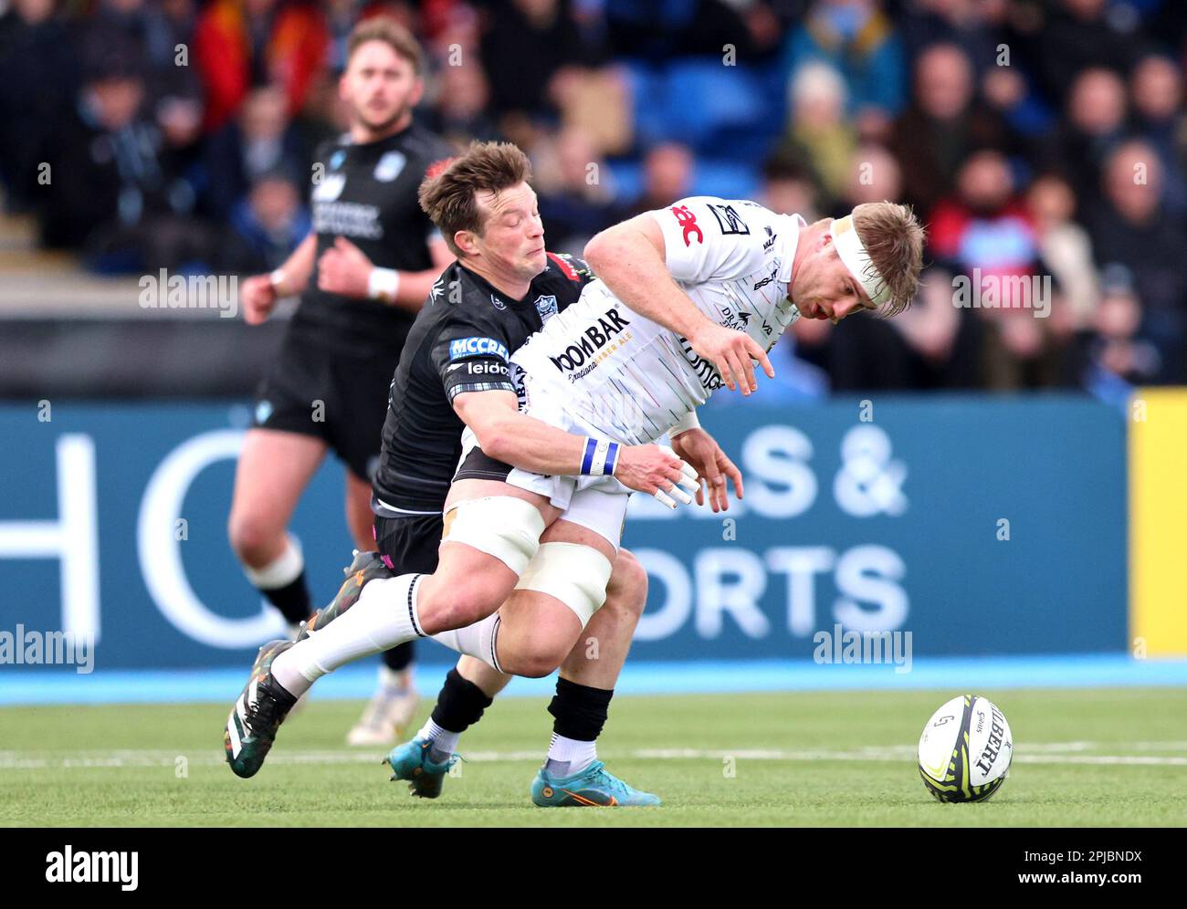 Dragons' Aaron Wainwright (left) is tackled by Glasgow Warriors' George ...