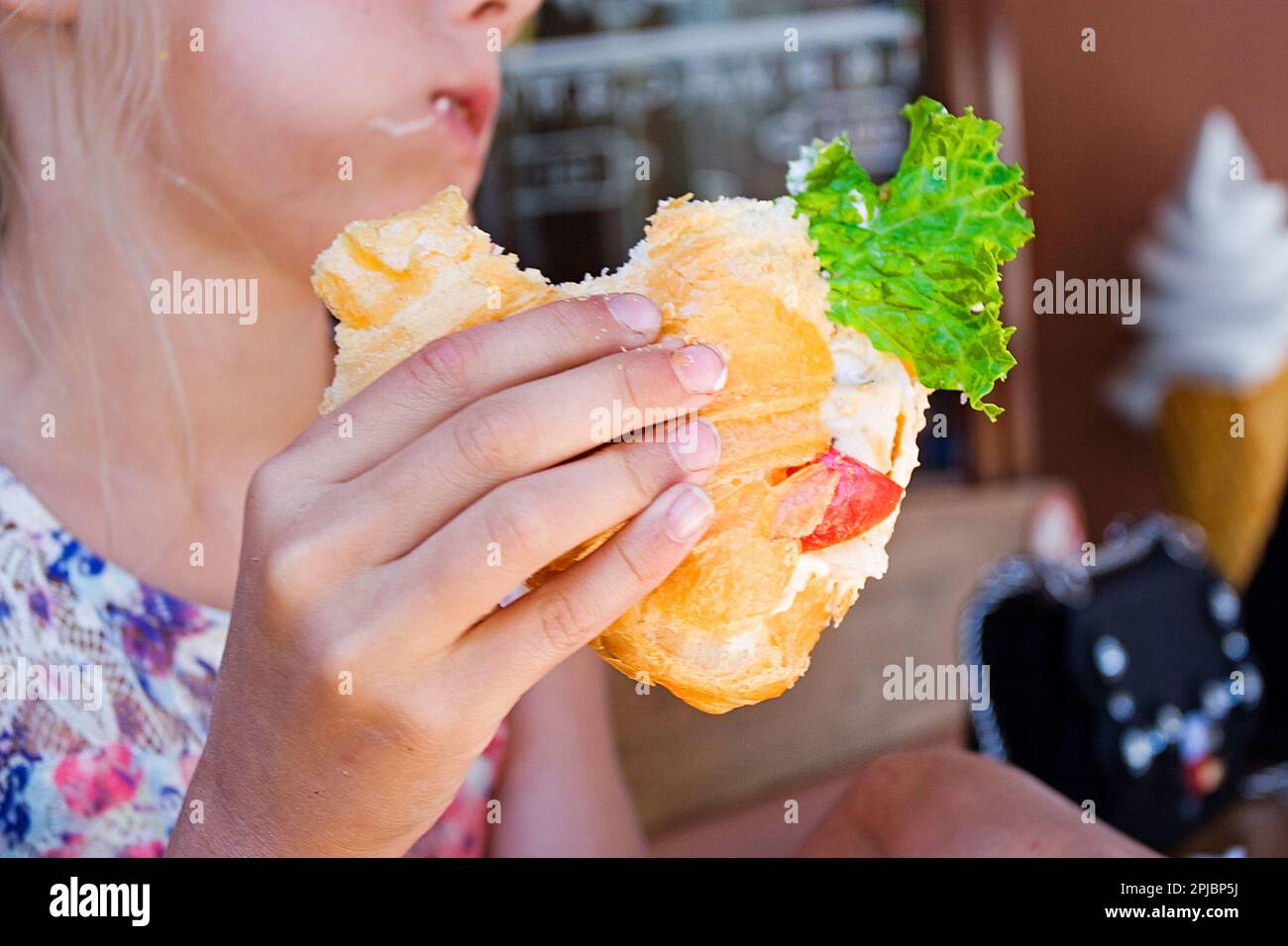 slice of sandwich in hand Stock Photo - Alamy