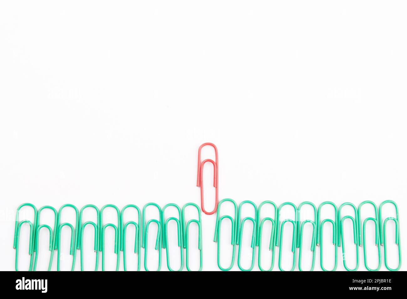 Top view of paperclip on white background with text space, unique ...