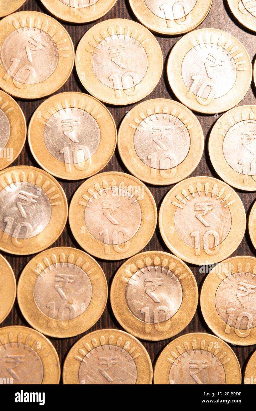 Top view of indian currency coin texture background Stock Photo - Alamy