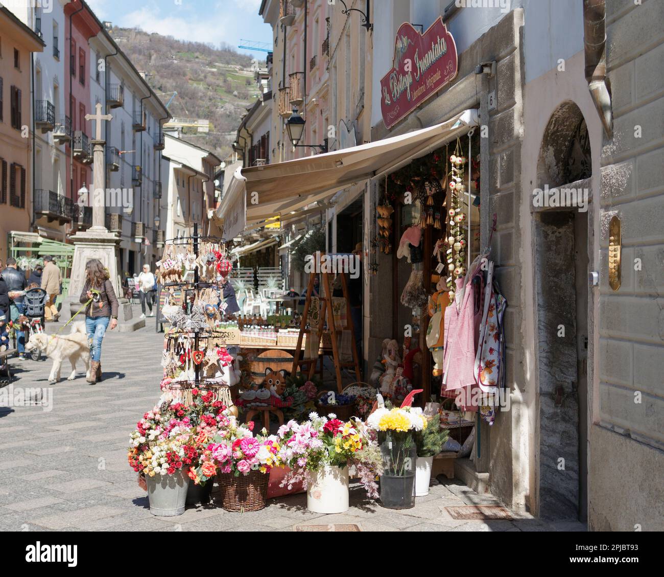 Flower shop with exterior flower display with a monument behind in a ...