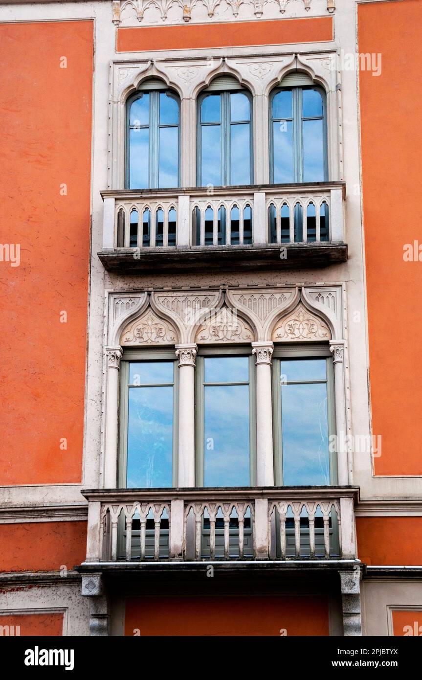 Venetian style windows over a corner cafe in Piazza Cavour, a main ...