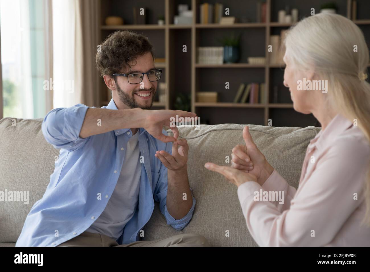 Two people talking sign language hi-res stock photography and images ...