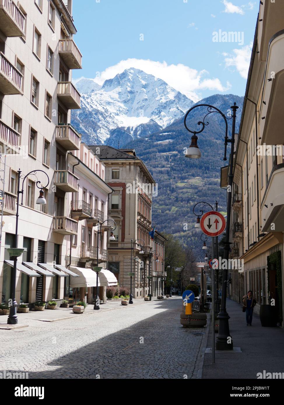 Aosta Street with road signs and high rise buildings on a sunny day ...