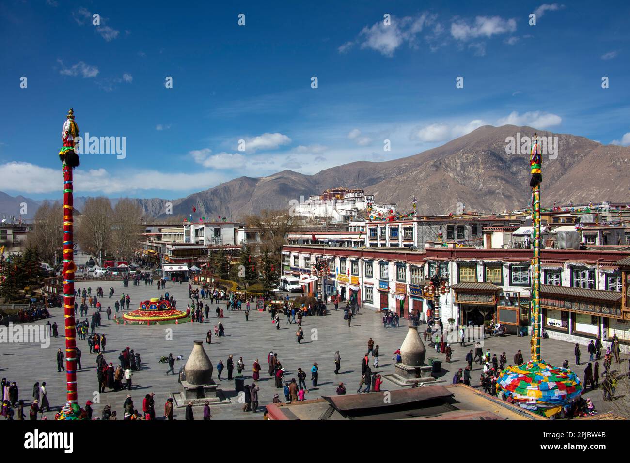 A diverse crowd of people standing outside of Potala Palace in Lhasa ...