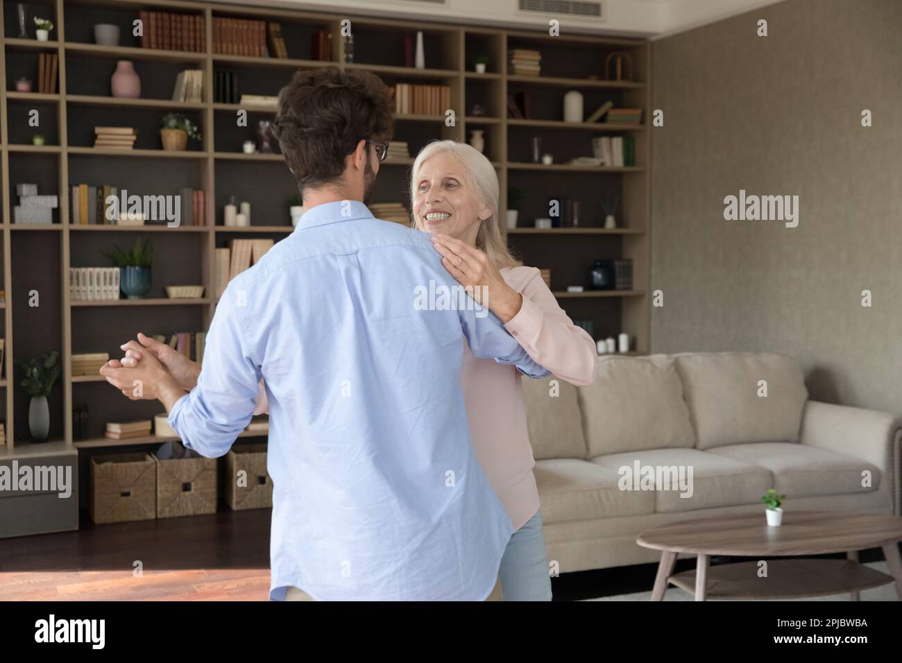 Happy different aged couple training social dance, waltz, tango Stock ...