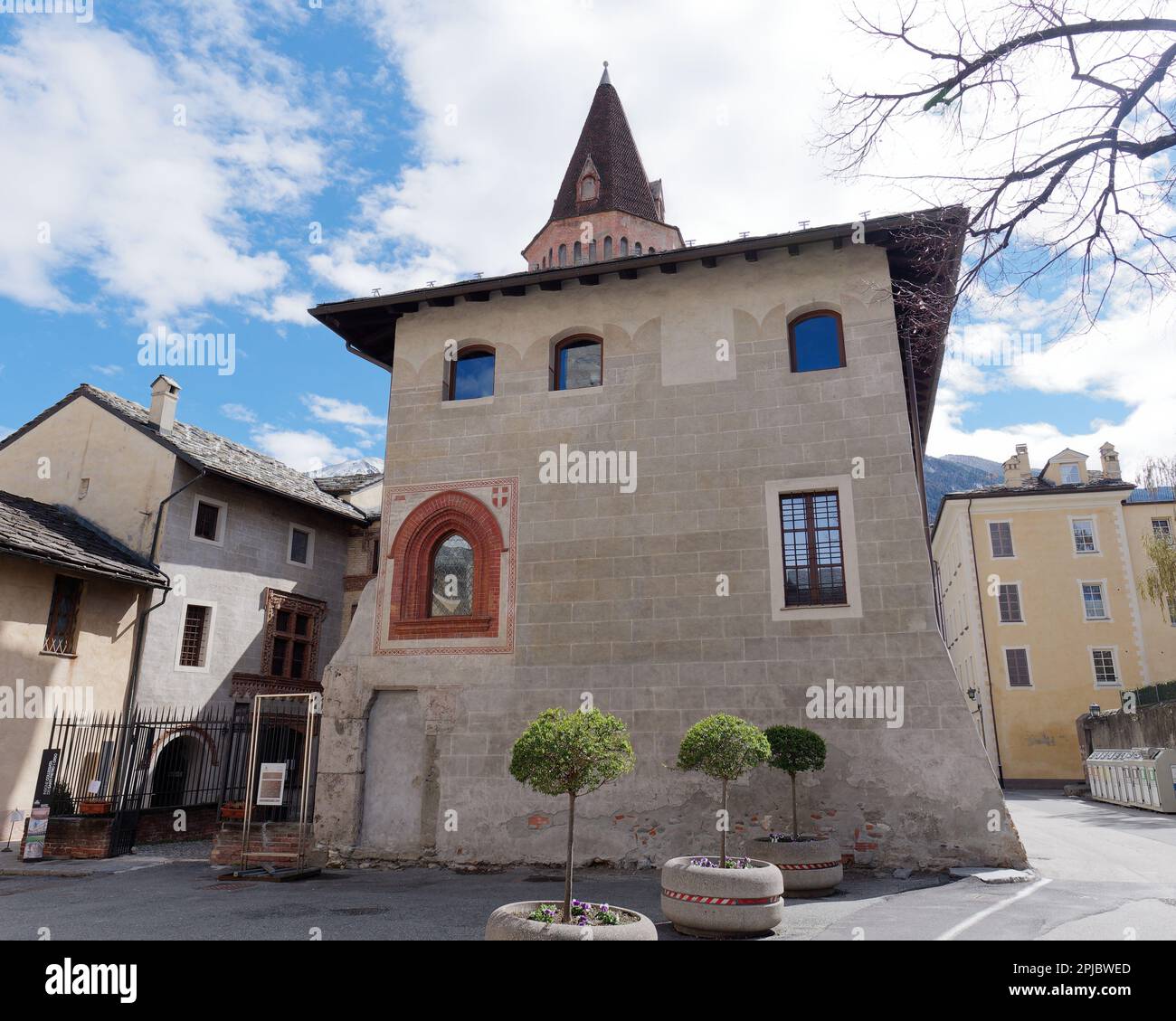Unusual shaped building with rotunda tower in the city of Aosta, Aosta ...
