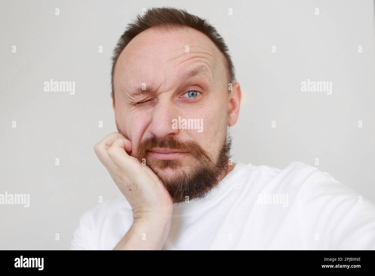 shot mans hand is unrestrained scratching unshaven chin. Overgrown ...