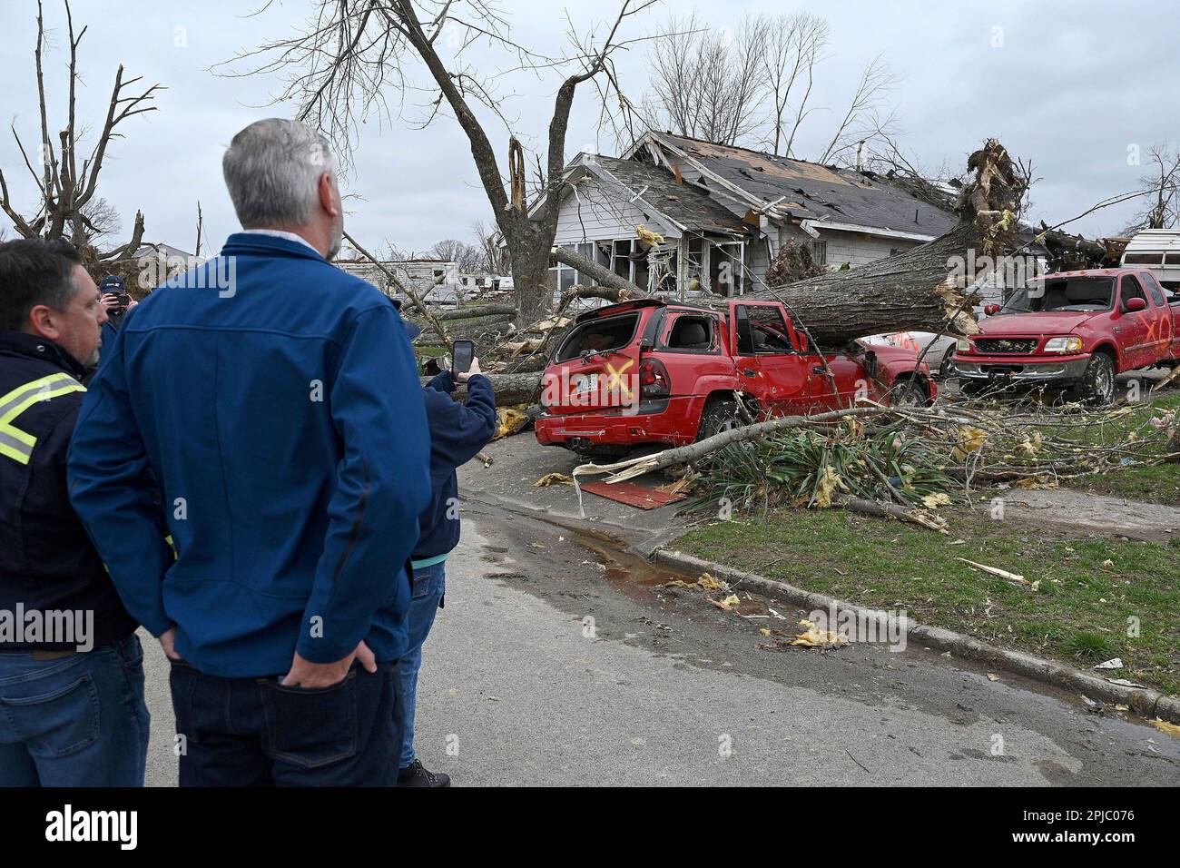 Sullivan Mayor Clint Lamb and Indiana Governor Eric Holcomb survey the ...