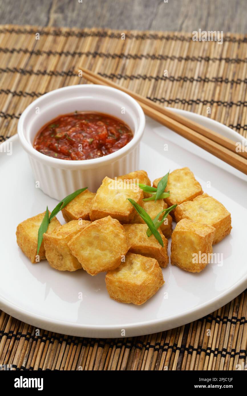 crispy cubed tofu puffs with chili sauce Stock Photo - Alamy