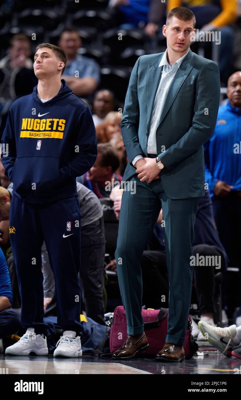 Denver Nuggets guard Collin Gillespie (21) and Denver Nuggets center ...