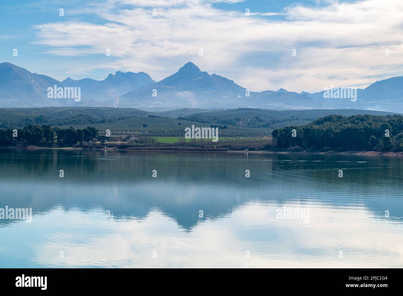 Panoramic view of Sierra Arana (Granada, Spain) and its reflection in ...