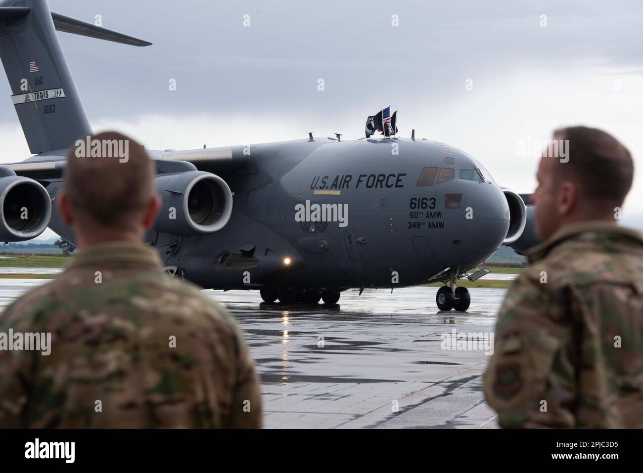 U.S. Air Force Col. Derek Salmi, left, 60th Air Mobility Wing commander ...