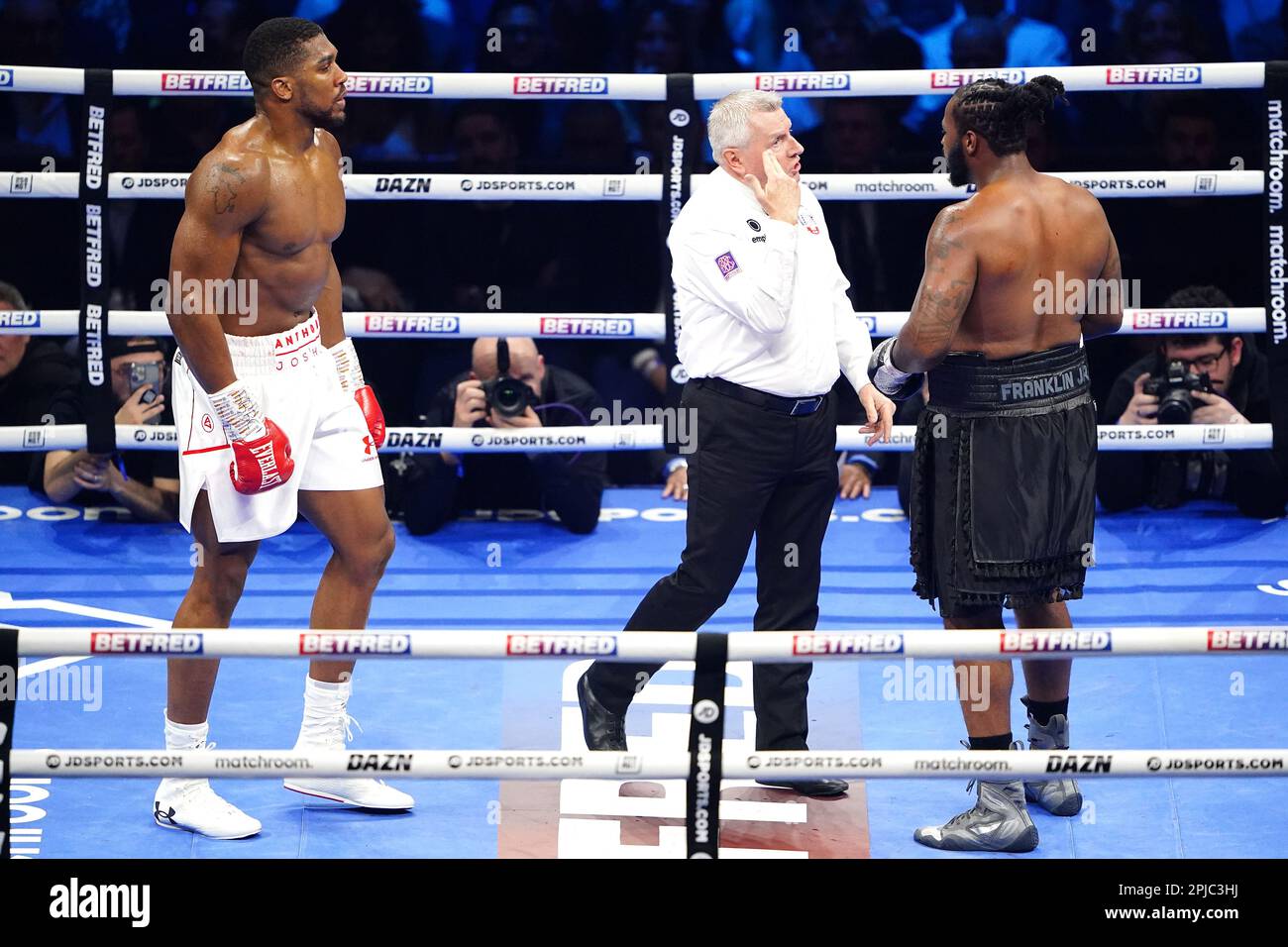 Referee Marcus McDonnell (centre) speaks to Jermaine Franklin before ...