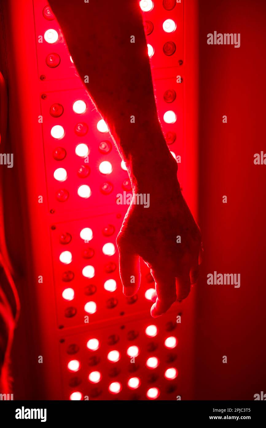 Far Infared Light Therapy on the Arm and Hand Stock Photo - Alamy