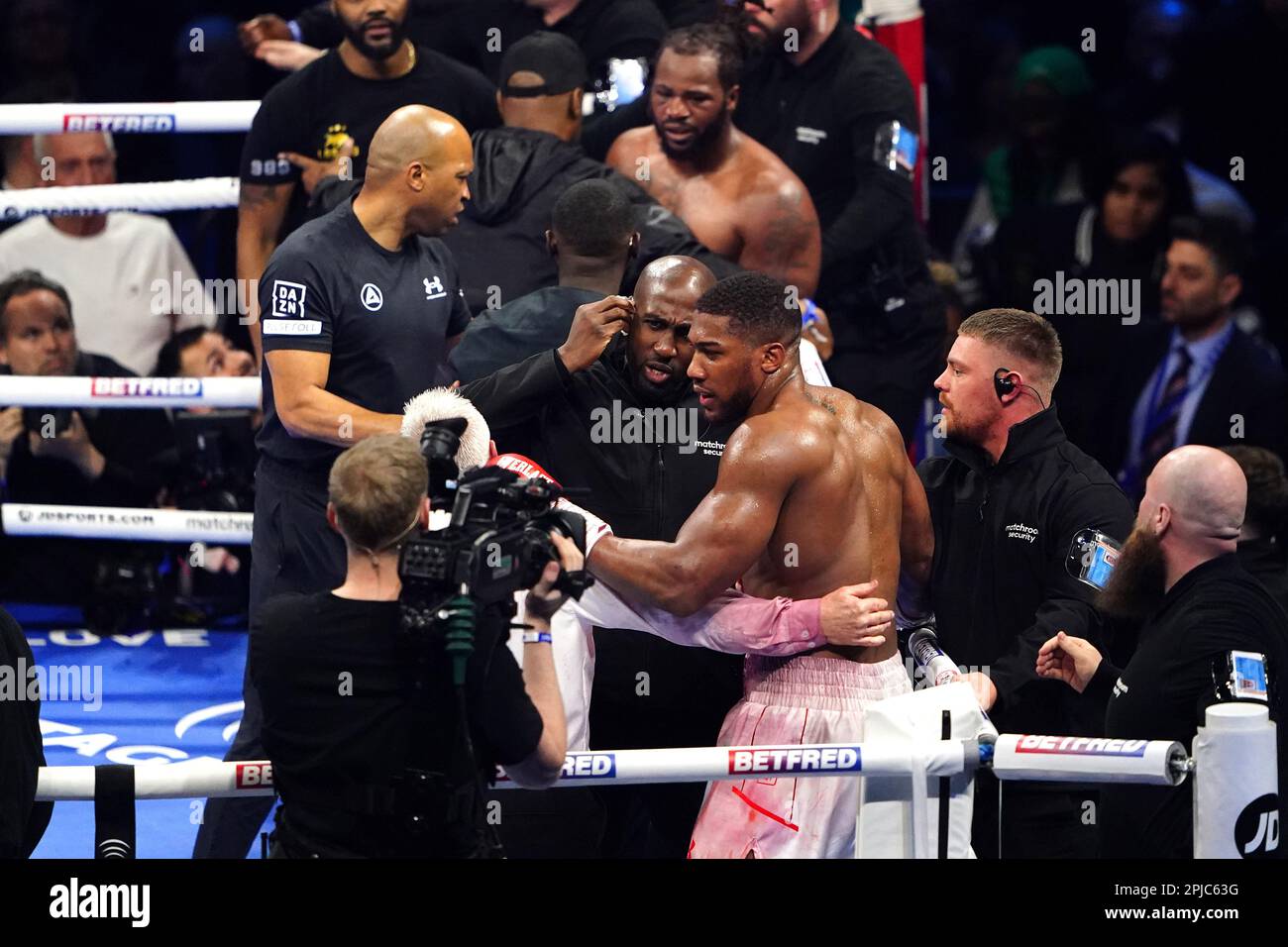 Anthony Joshua is pulled away by referee Marcus McDonnell after ...