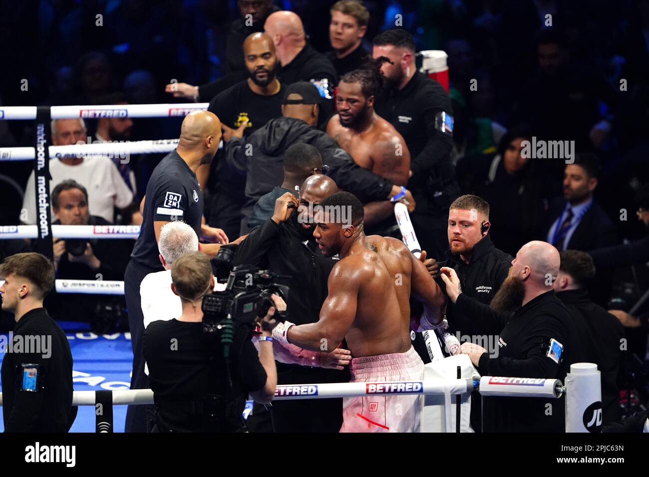Anthony Joshua is pulled away by referee Marcus McDonnell after ...