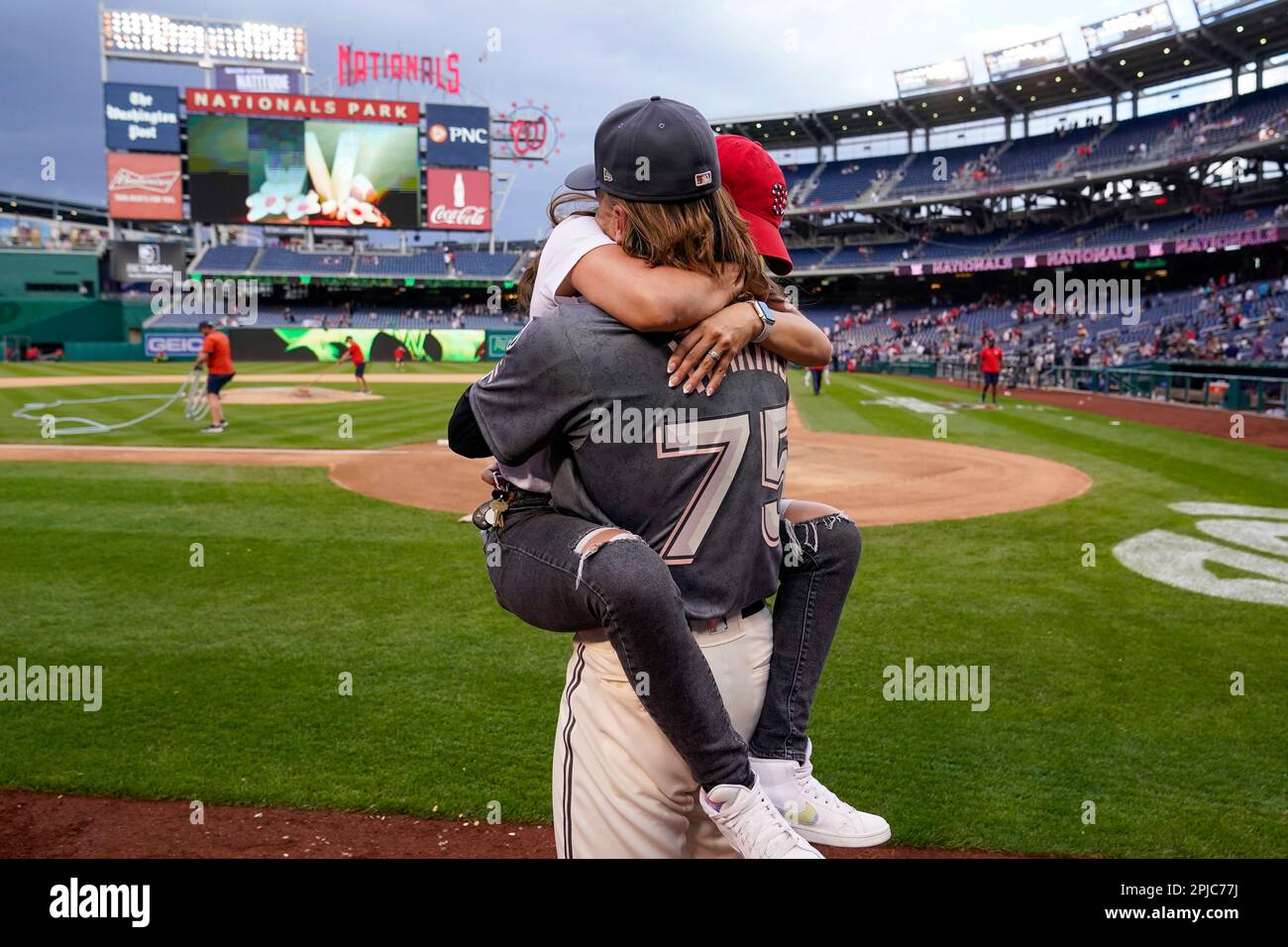 Washington Nationals pitcher Hobie Harris hugs his wife, Ally Harris ...