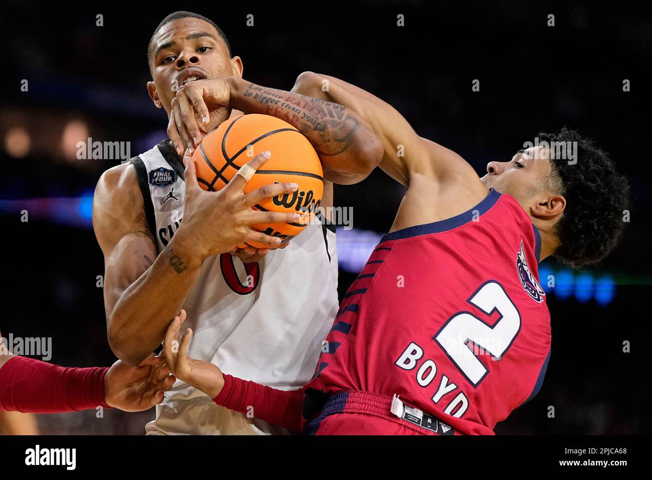 San Diego State forward Keshad Johnson, left, vies for the ball with ...