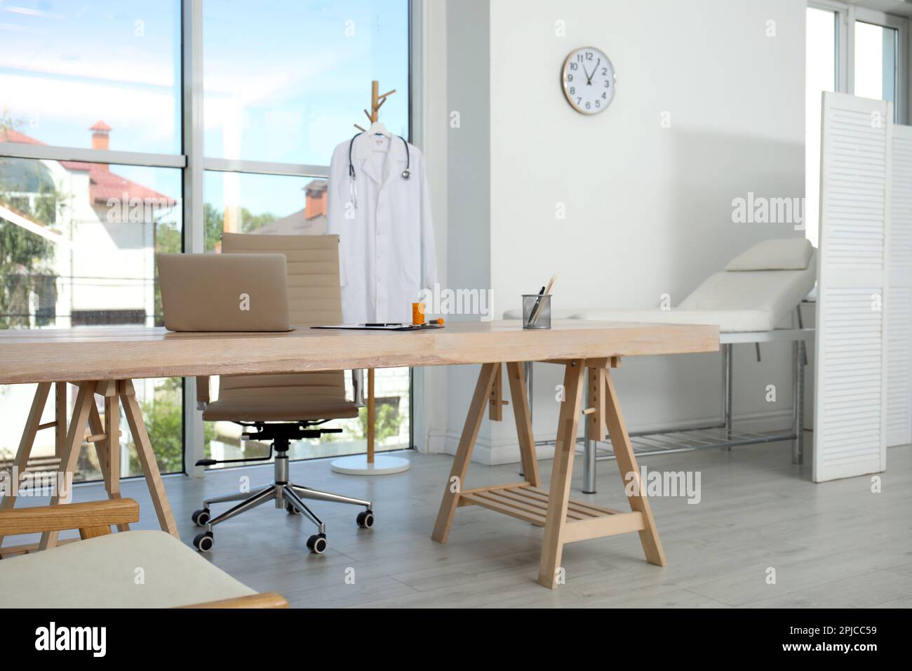Modern medical office interior with doctor's workplace near window ...
