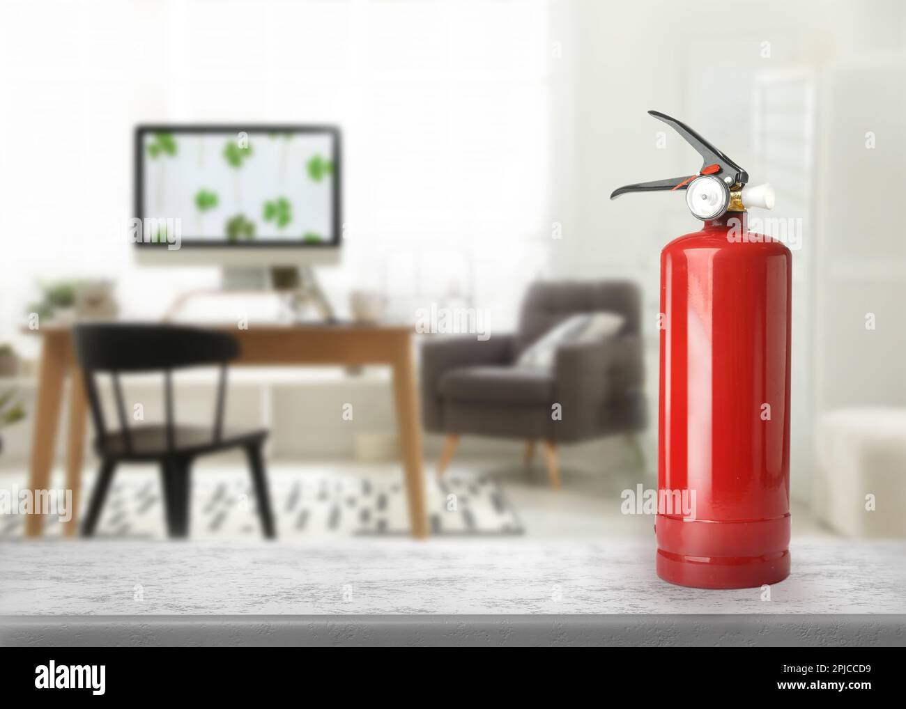 Fire extinguisher on stone table in living room. Space for text Stock ...