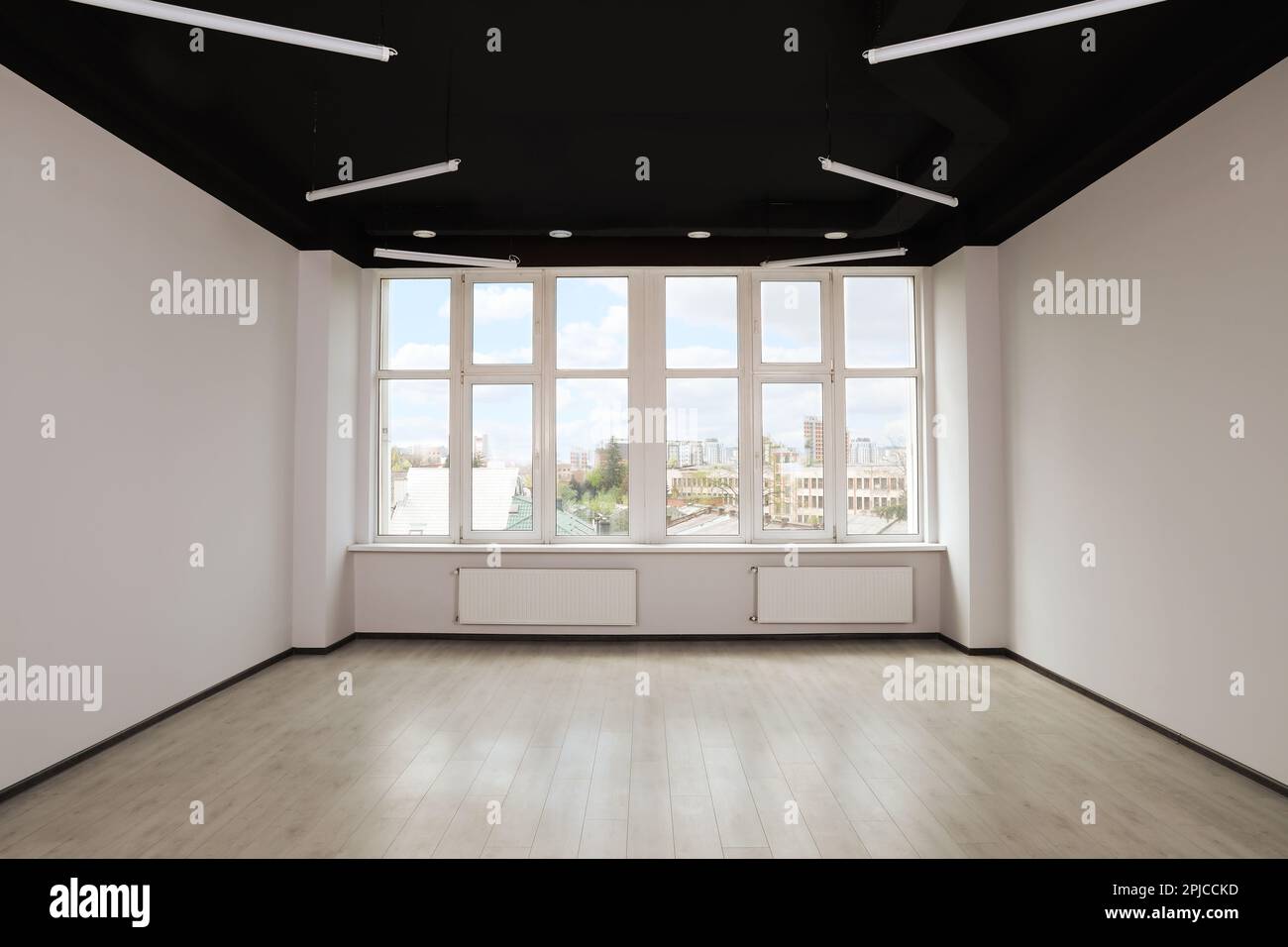 Modern office with window and radiators. Interior design Stock Photo ...