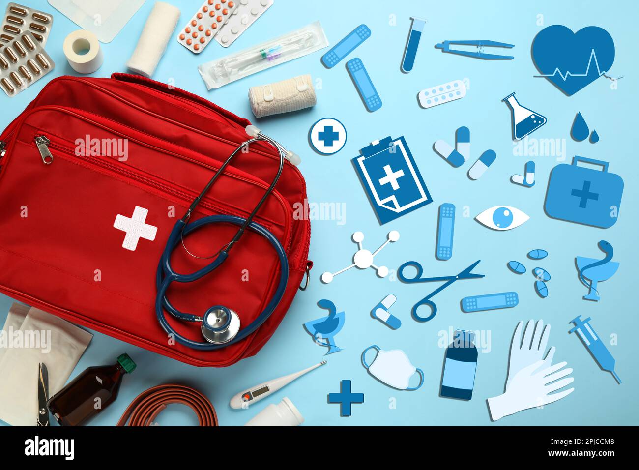 First aid kit and different images on light blue background, flat lay ...