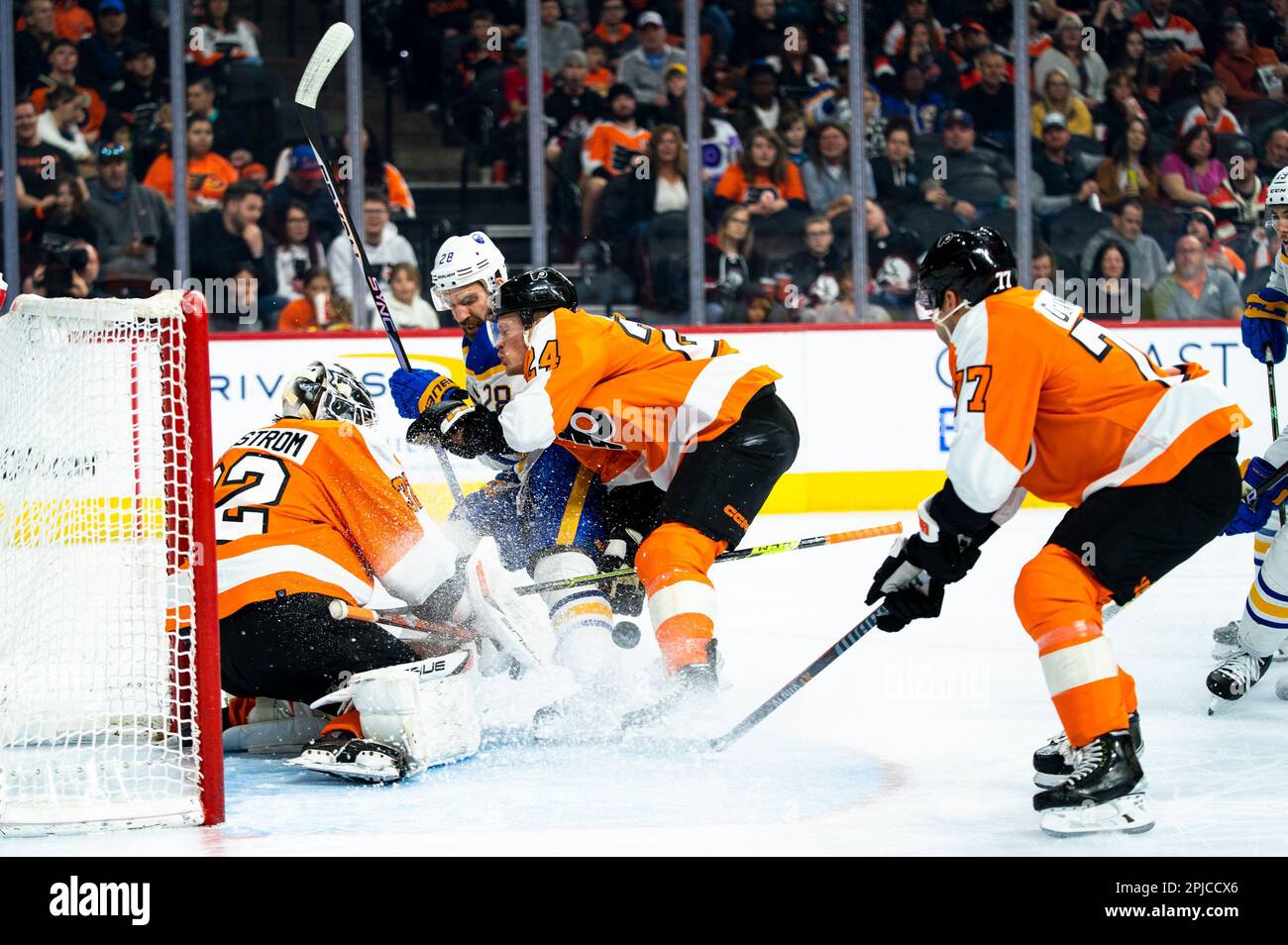 Philadelphia Flyers' Felix Sandstrom, left, makes the save on a shot by ...