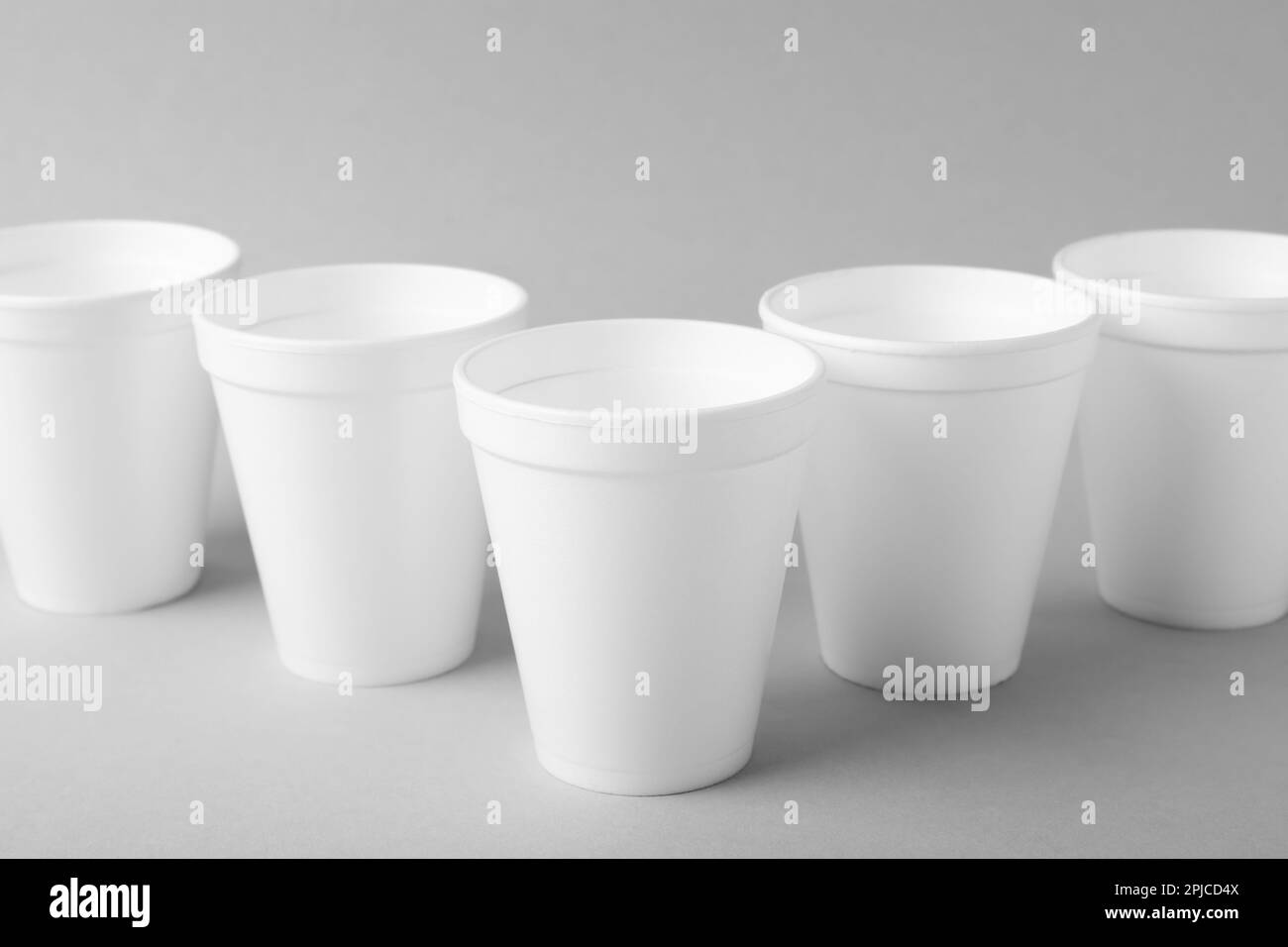 Styrofoam cups on light grey background, closeup Stock Photo - Alamy