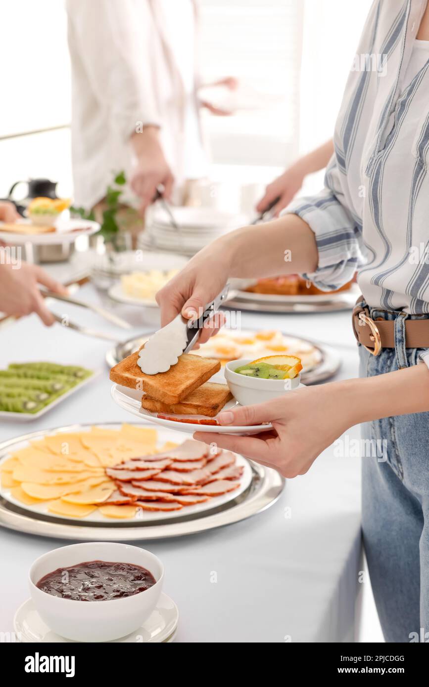 People taking food during breakfast, closeup. Buffet service Stock ...