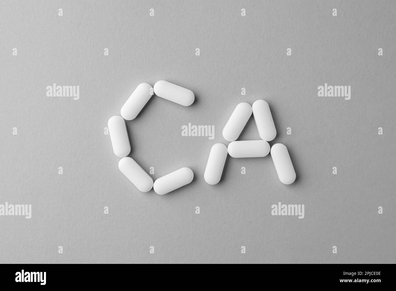 Calcium supplement pills on light grey background, flat lay Stock Photo ...