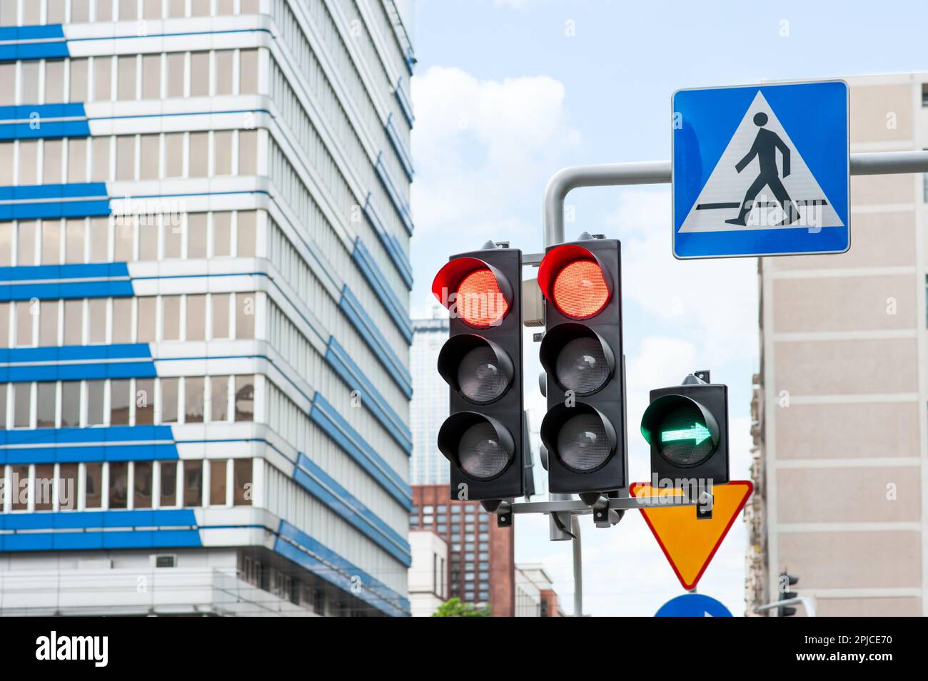 Traffic lights and Pedestrian Crossing road sign in city Stock Photo ...