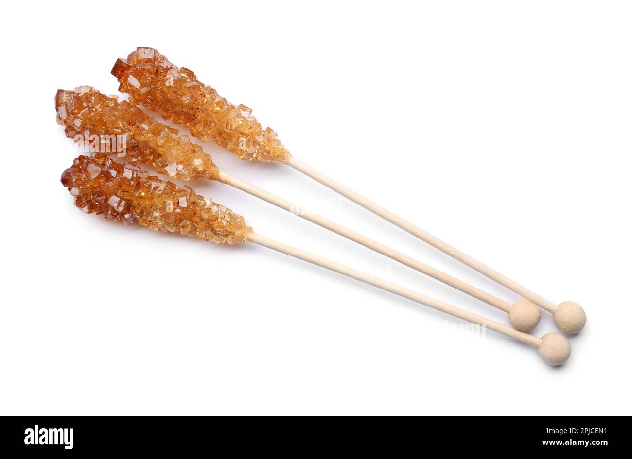Wooden sticks with sugar crystals isolated on white, top view. Tasty ...