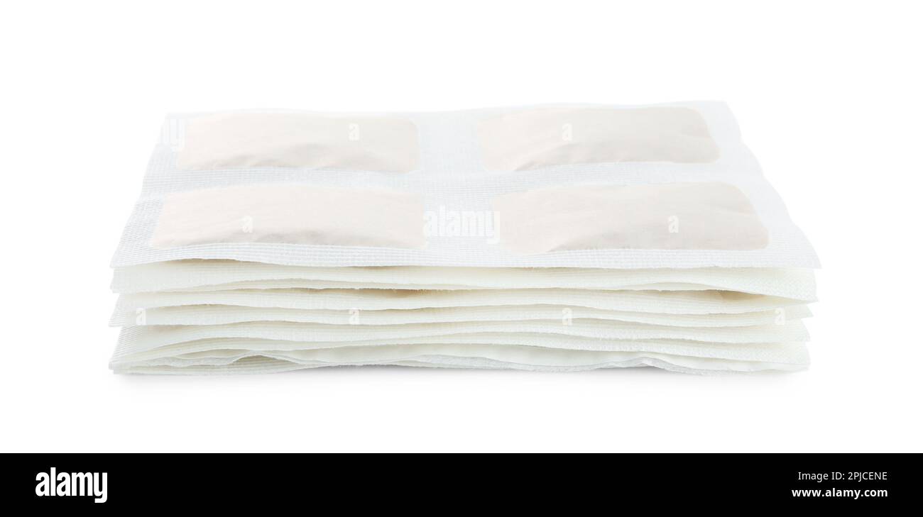 Stack of mustard plasters on white background Stock Photo - Alamy